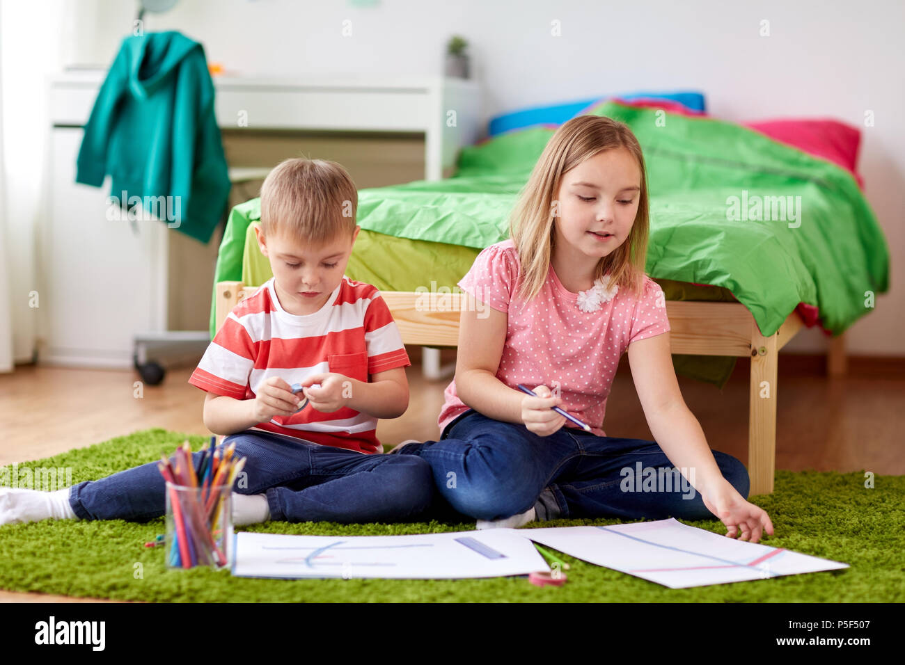 happy kids drawing at home Stock Photo - Alamy
