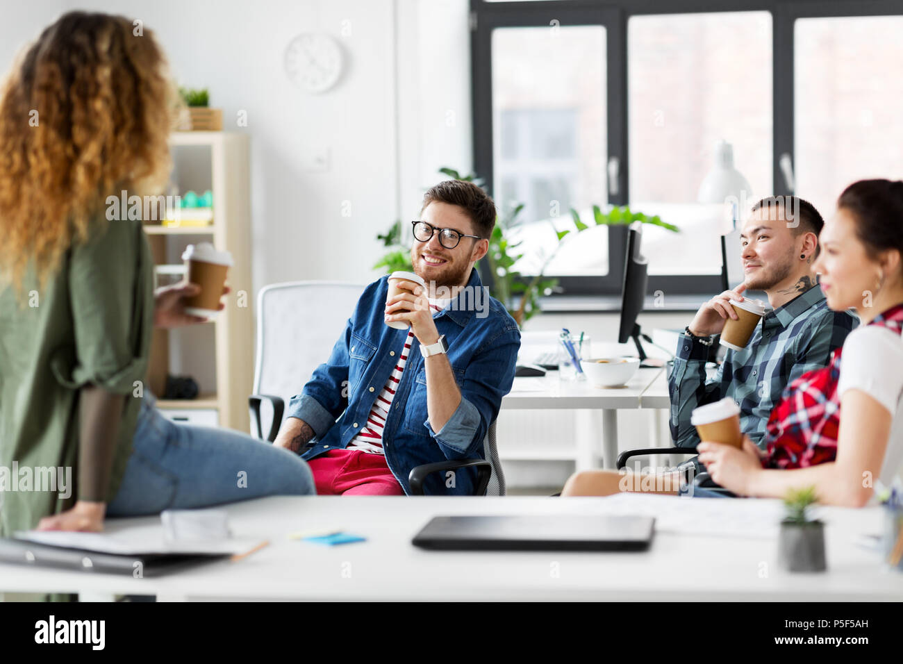 creative team drinking coffee at office Stock Photo - Alamy