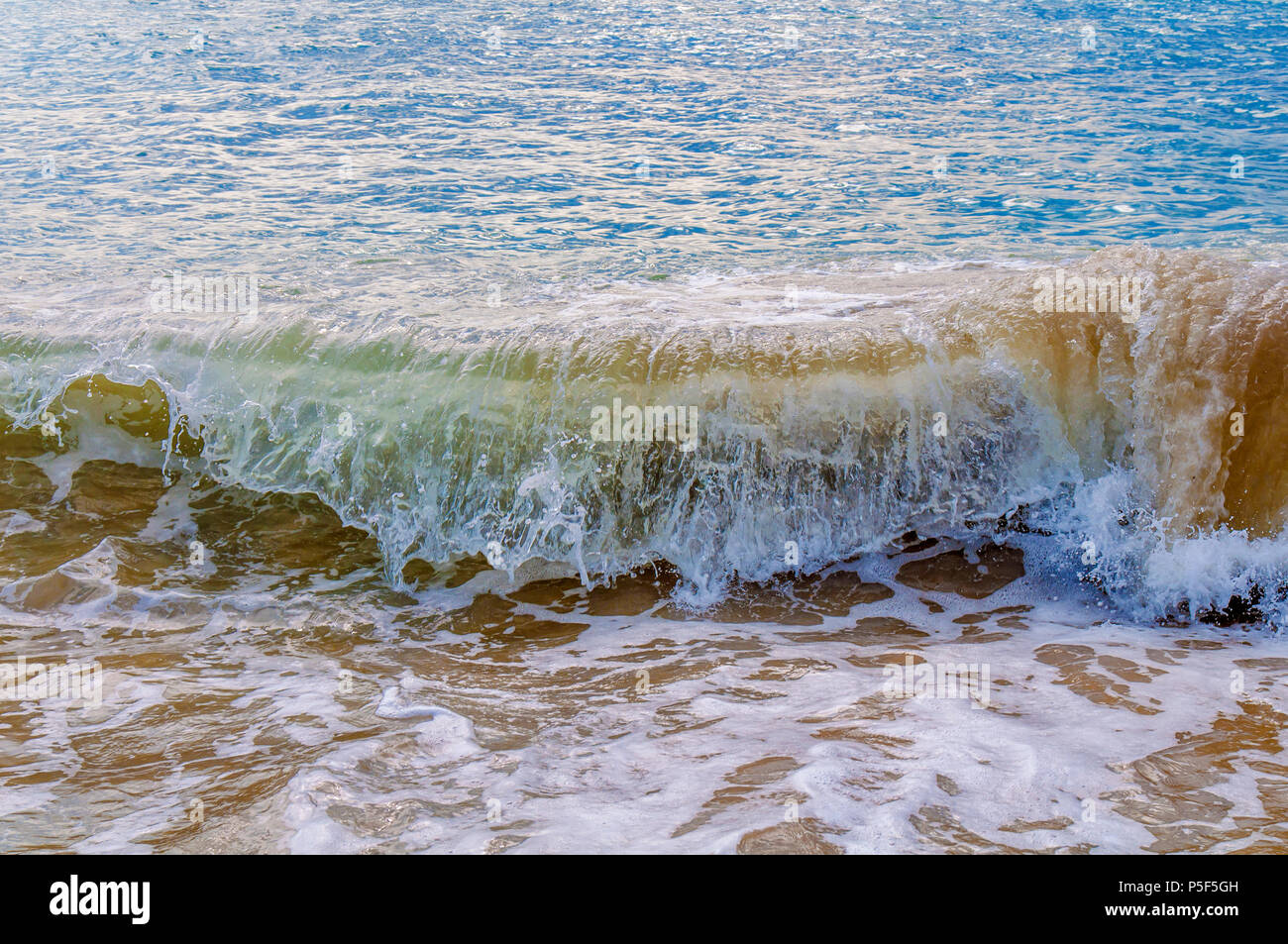 Big wave on sea with beach background Stock Photo - Alamy