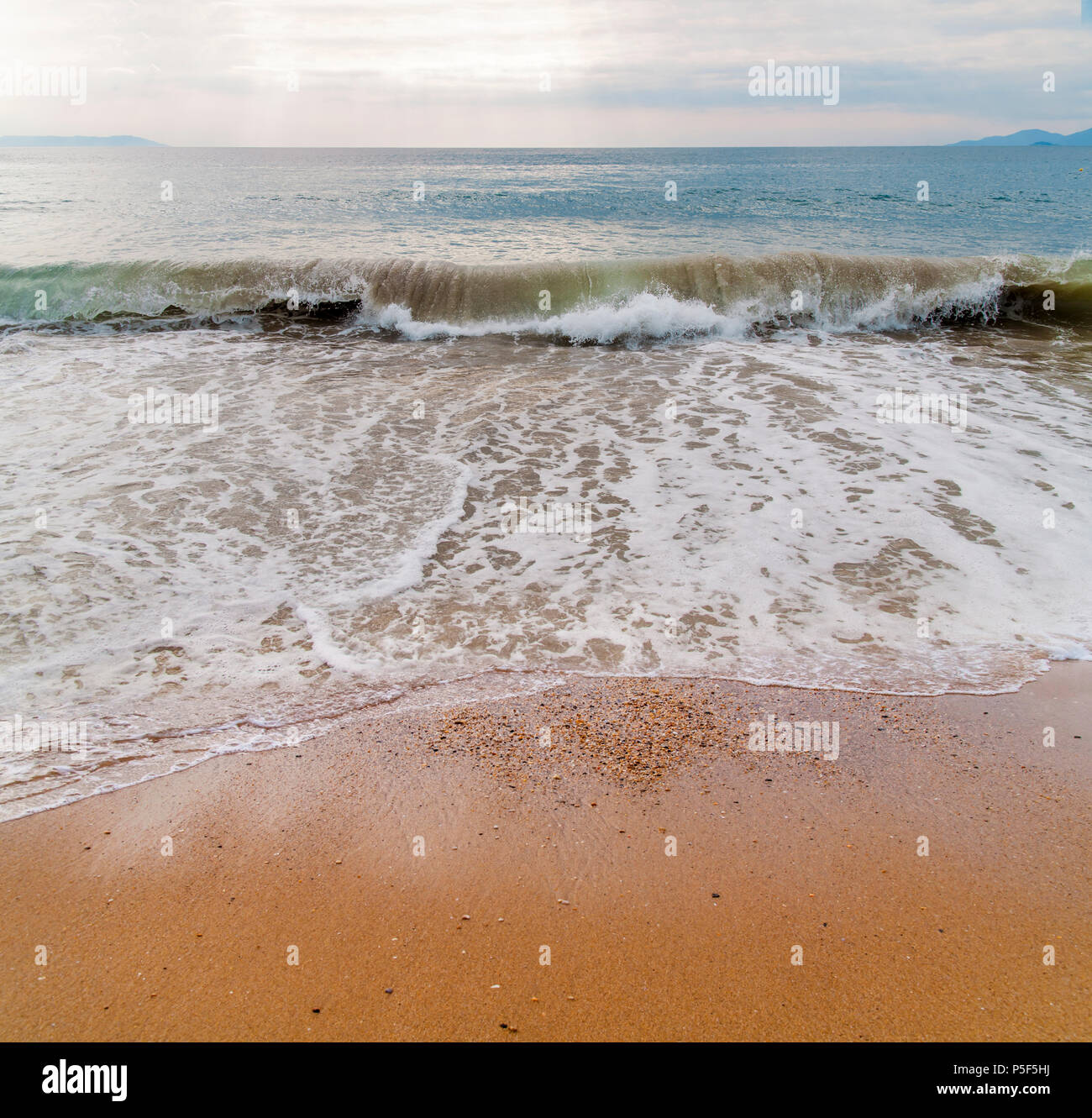 Big wave on sea with beach background Stock Photo - Alamy