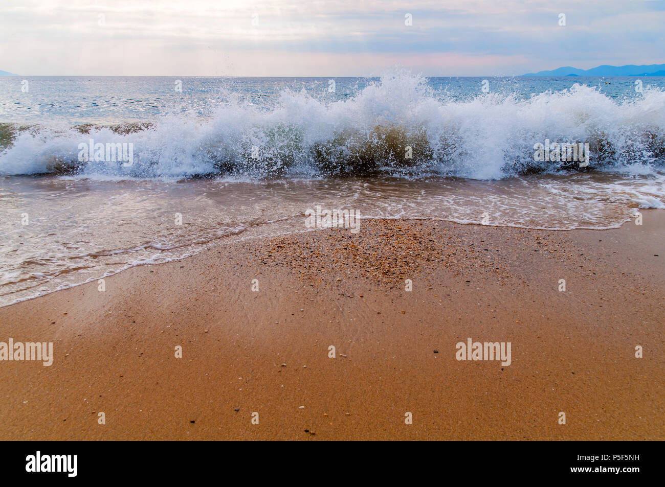 Big wave on sea with beach background Stock Photo - Alamy