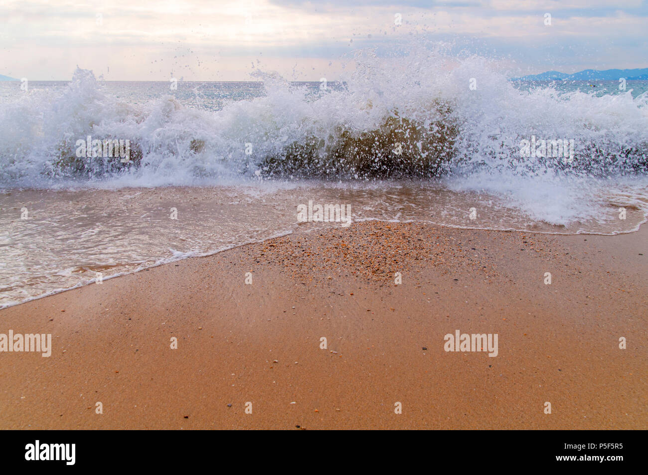 Big wave on sea with beach background Stock Photo - Alamy