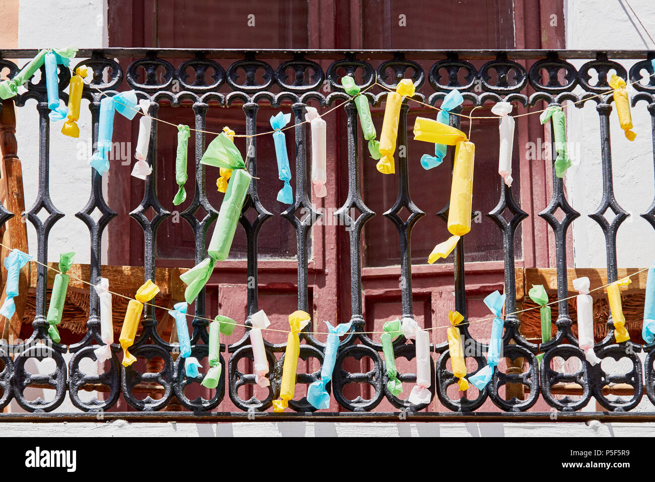 fake firecrackers on a balcony in spain Stock Photo - Alamy
