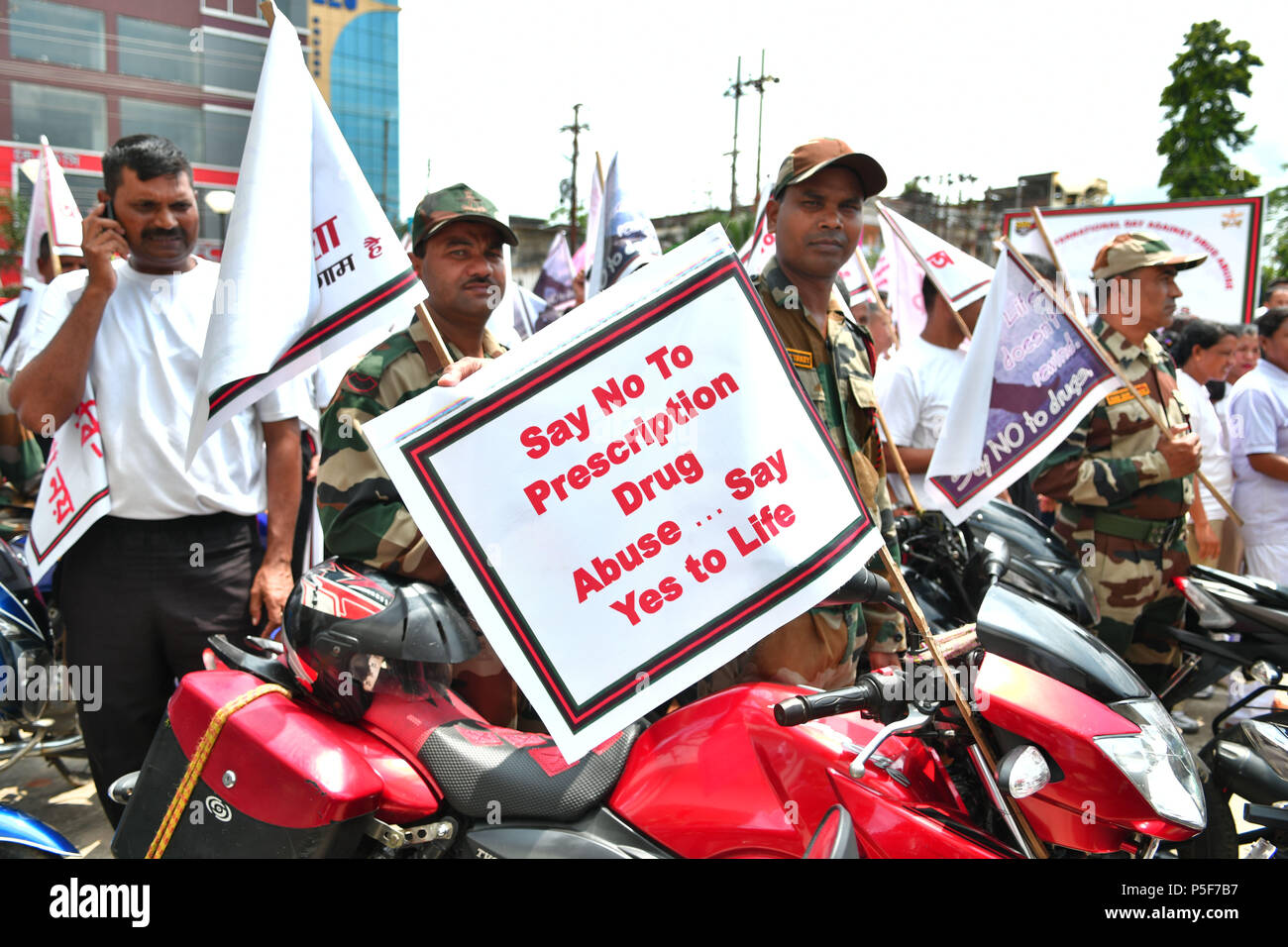 Members of Indian Paramilitary Force holding flags during the rally ...