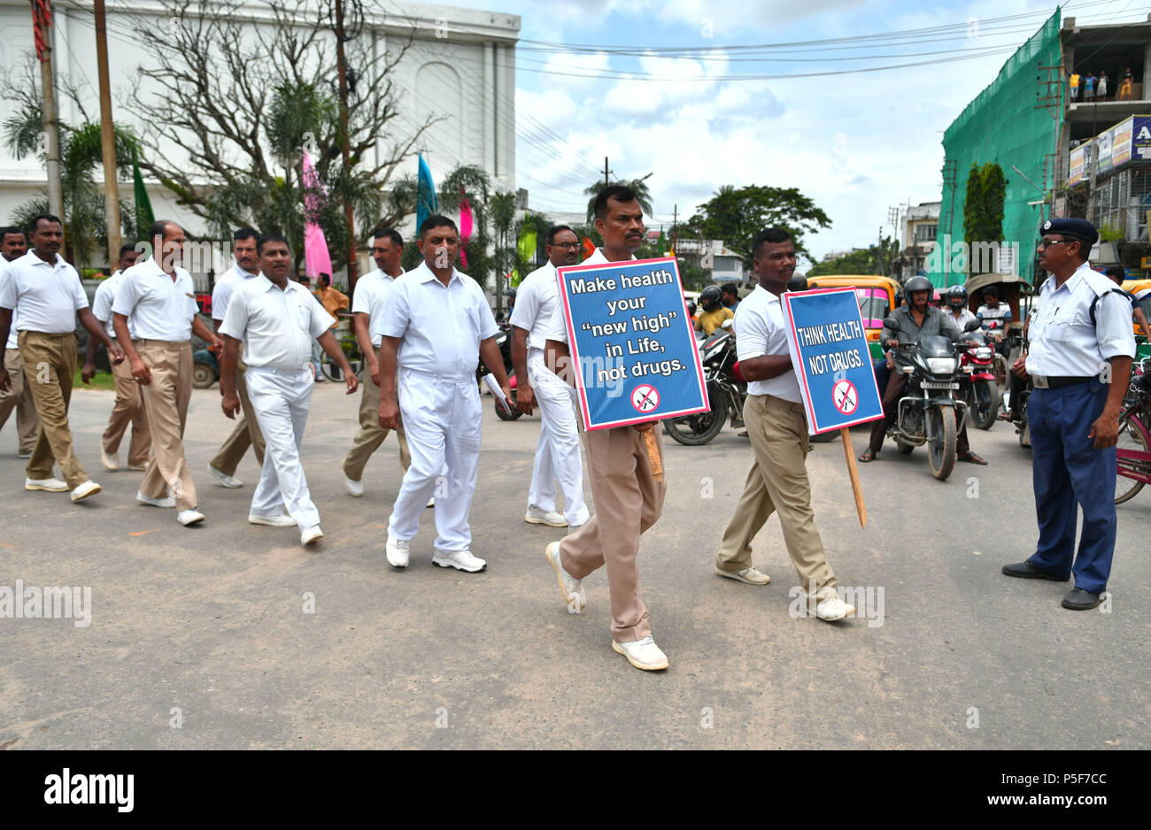Members of Indian Police marching with posters during the rally. Member ...