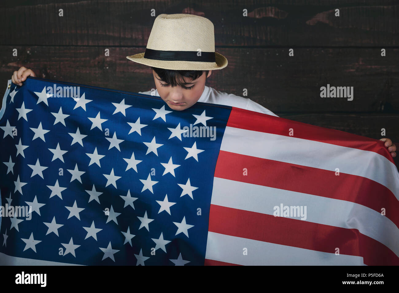 sad child with the flag of the United States,4th of July, Independence ...