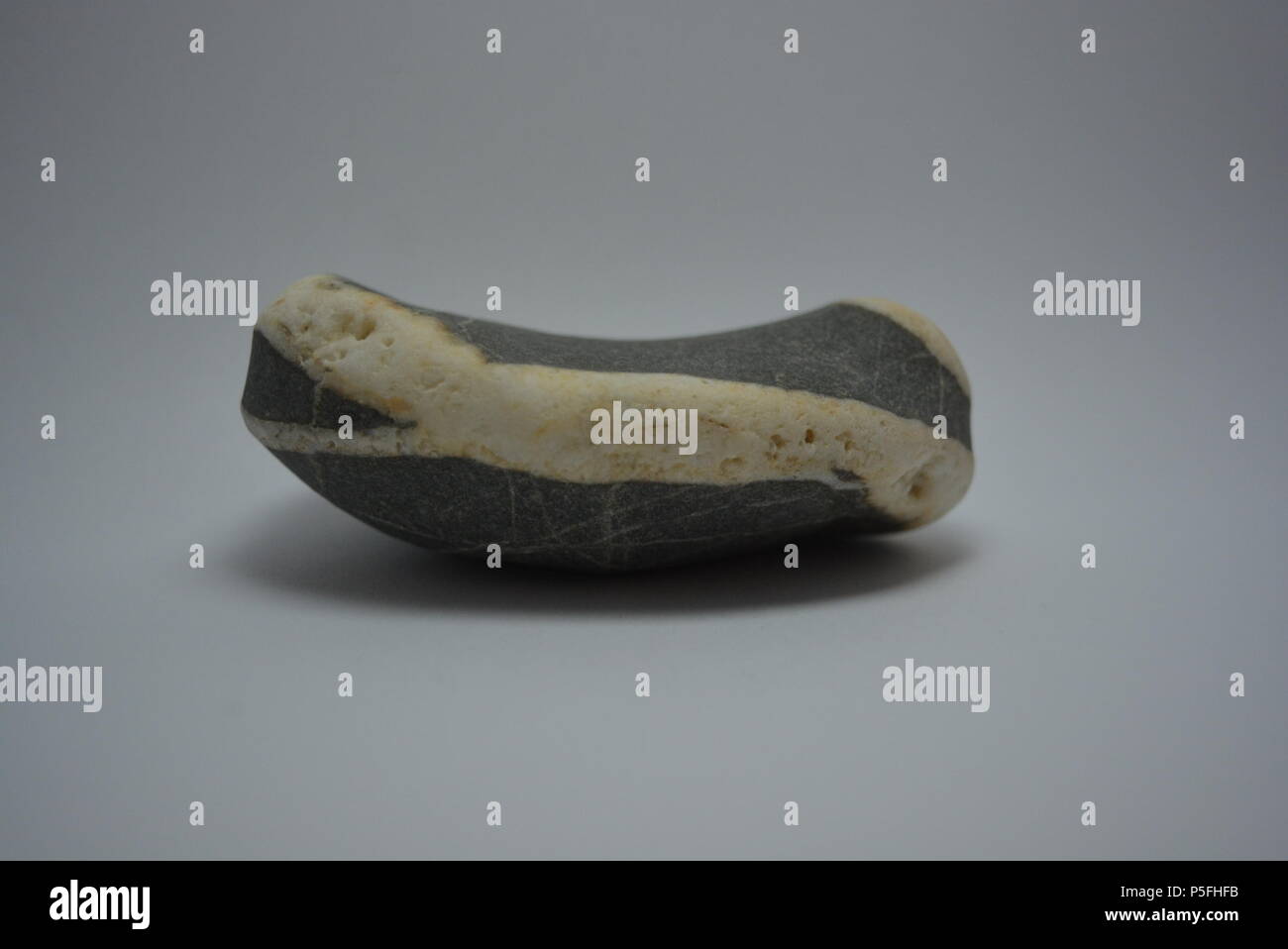 Interesting and unusual stones from the street and the sea are arranged ...