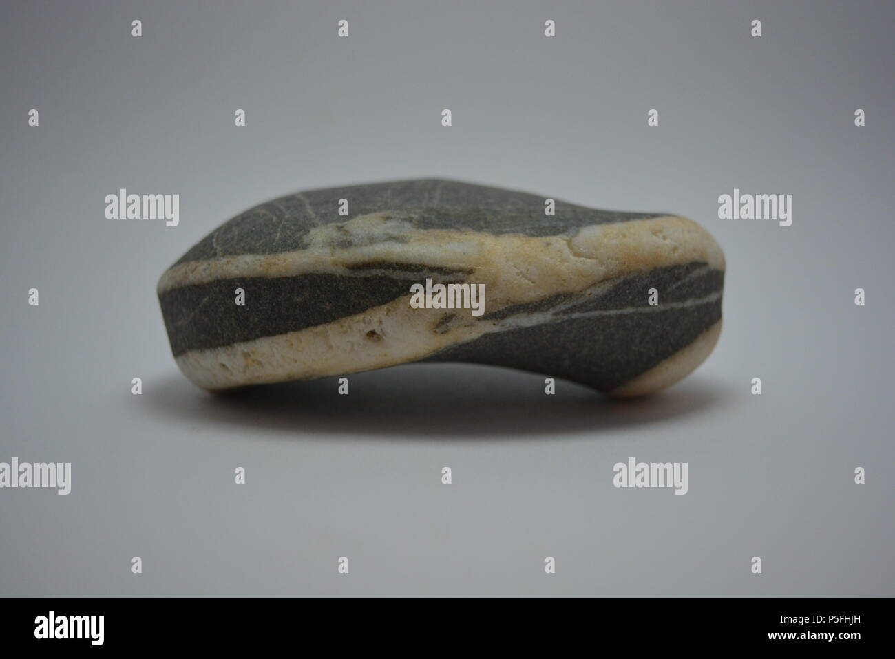 Interesting and unusual stones from the street and the sea are arranged ...