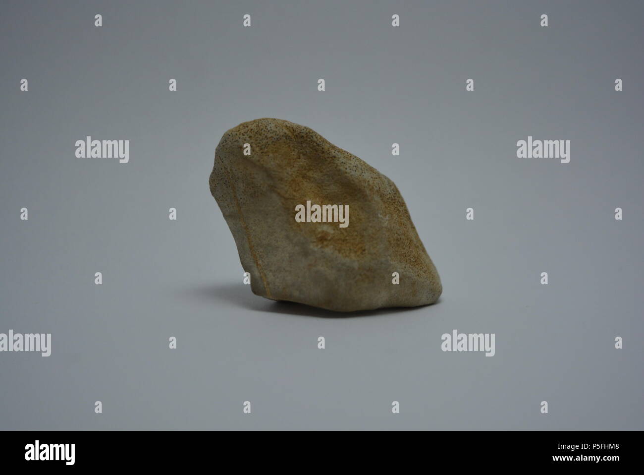 Interesting and unusual stones from the street and the sea are arranged ...