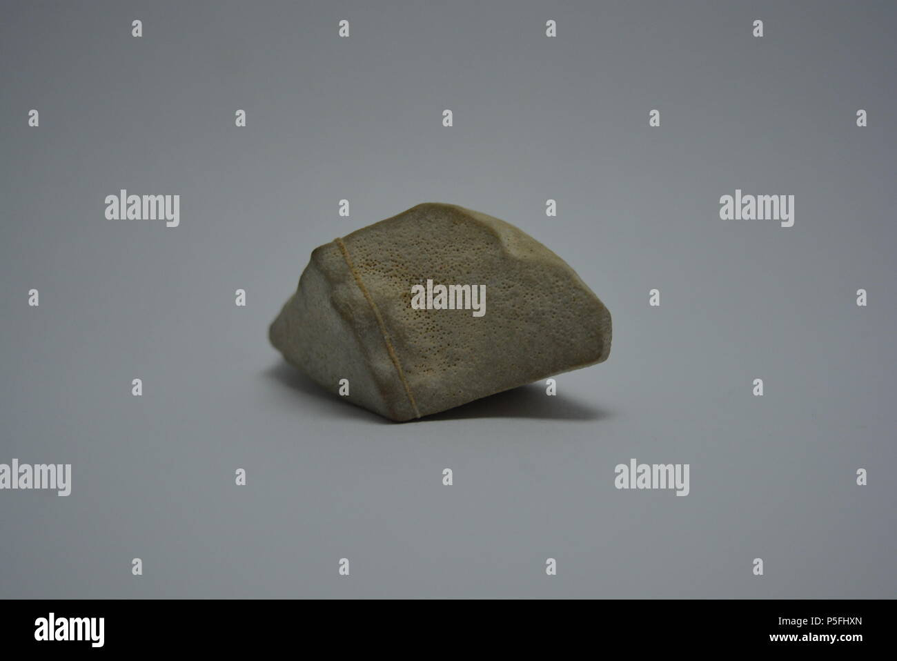 Interesting and unusual stones from the street and the sea are arranged ...