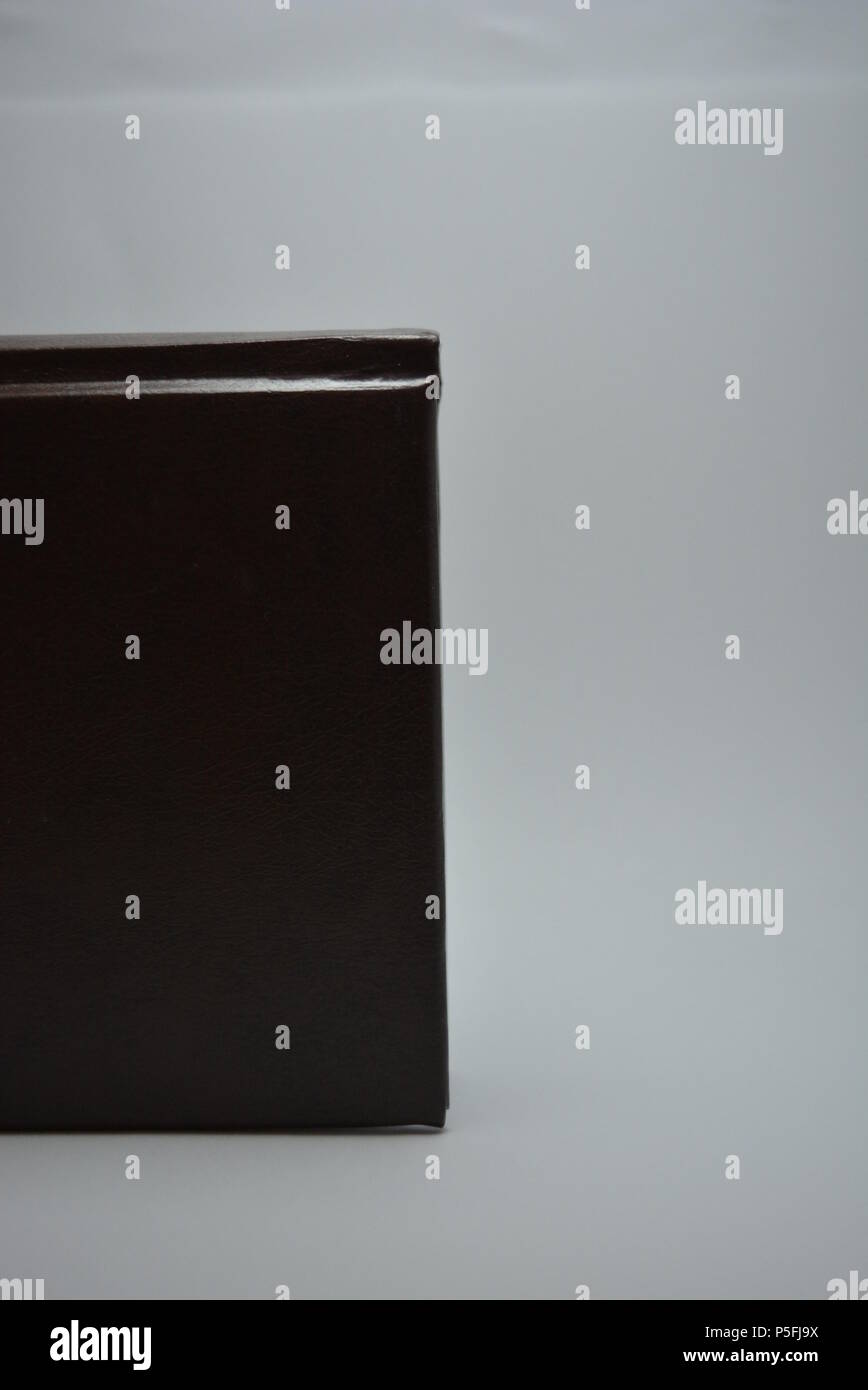 Brown, black small book, notebook with bookmark, diary arranged on ...