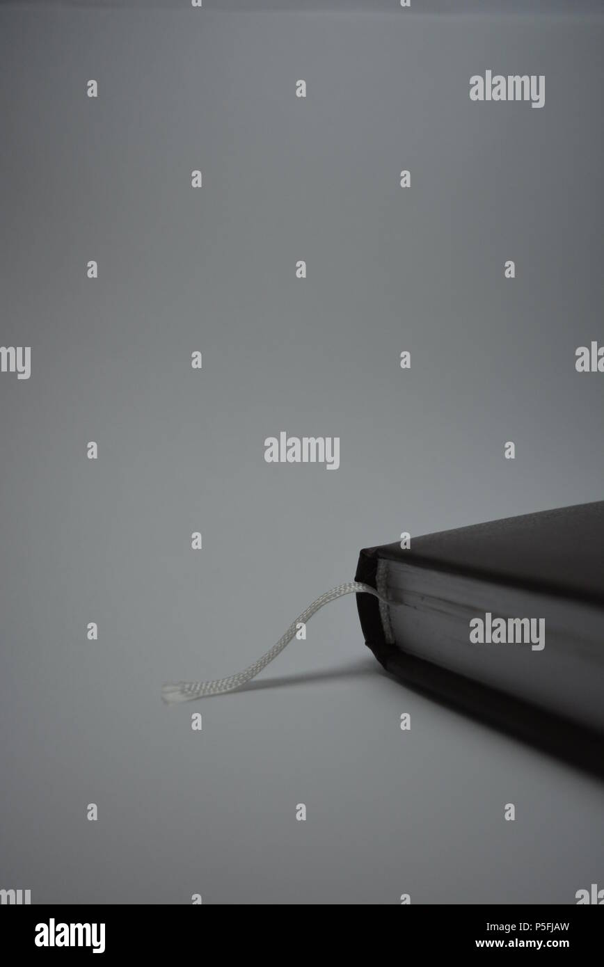 Brown, black small book, notebook with bookmark, diary arranged on ...