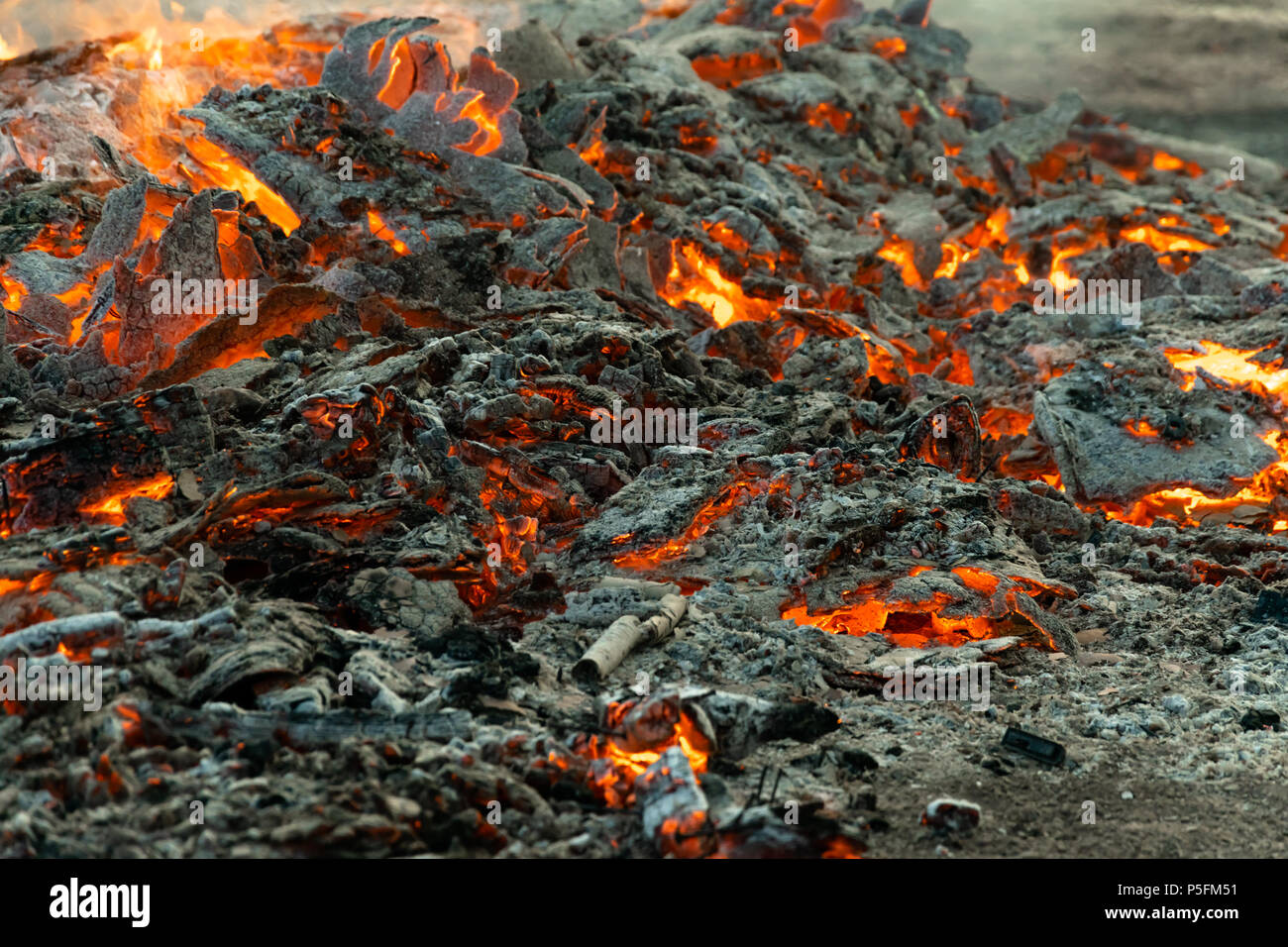 Ashes after burning furniture in a bonfire. Remains after a bonfire ...