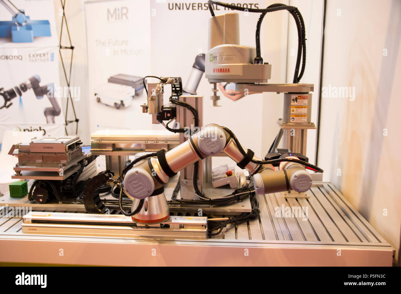 UR robot arm and pliers in cooperation with Yamaha in GR-EX Stock Photo ...