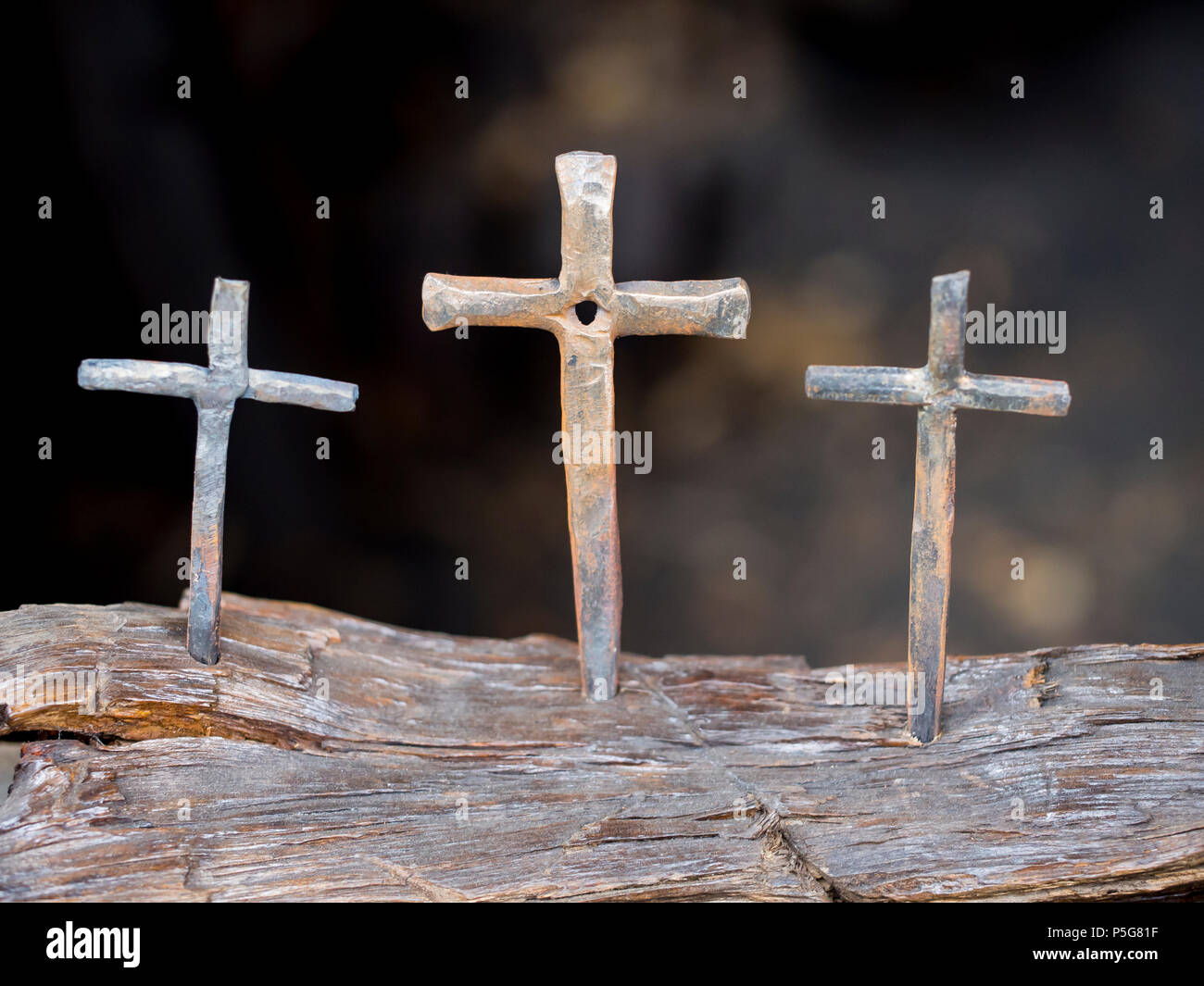 Hand crafted iron cross displayed in a blacksmith shop. Backgrounds in ...