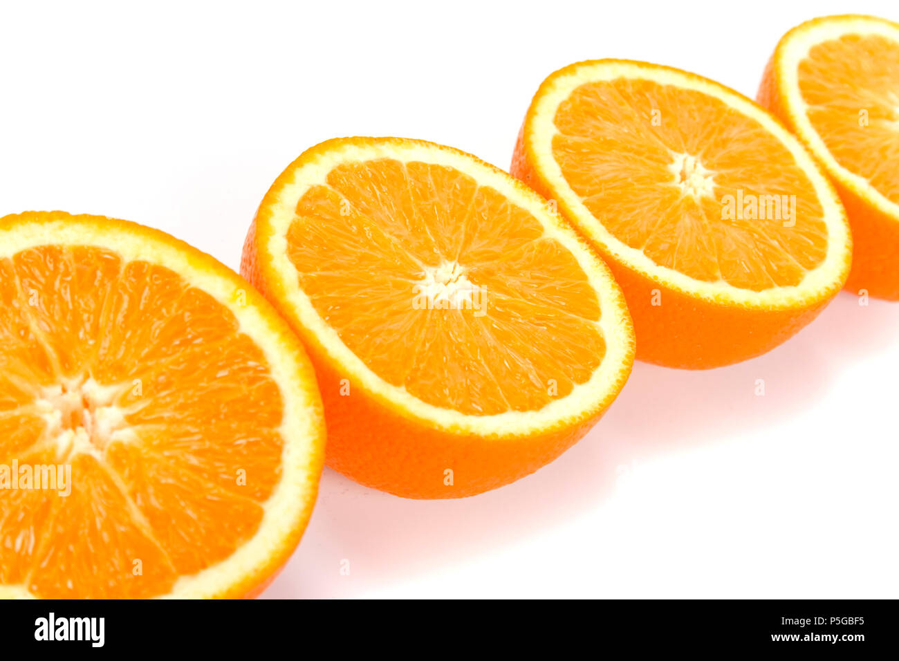 fresh oranges halves closeup on white Stock Photo - Alamy