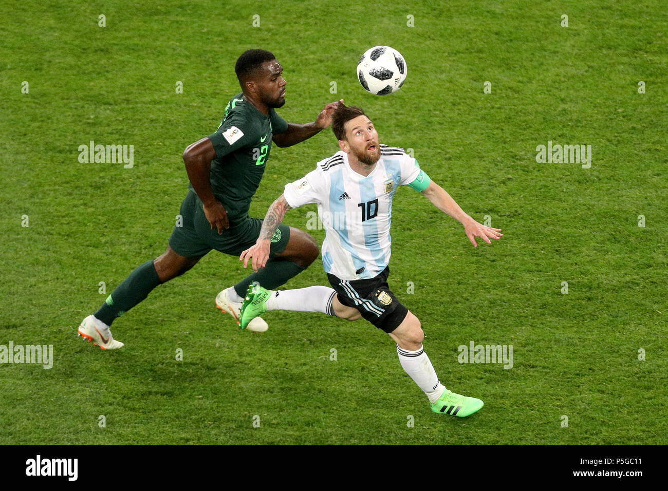 Argentina's Lionel Messi (right) and Nigeria's Brian Idowu (left ...
