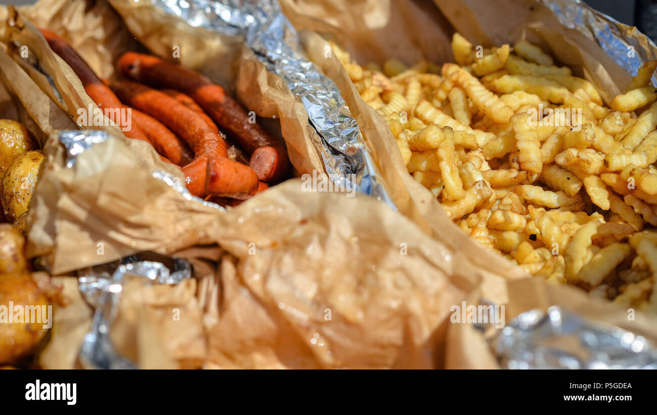 A variety of fried and grilled snacks on a large pan Stock Photo - Alamy