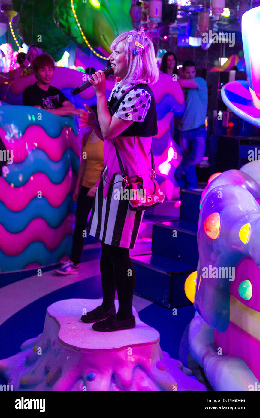 Female presenter announcing a show in Kawaii Monster Cafe, Tokyo Stock ...