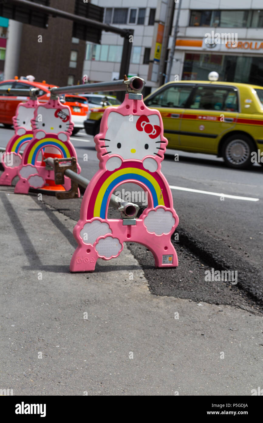 Hello Kitty barriers on the road in Tokyo Stock Photo - Alamy