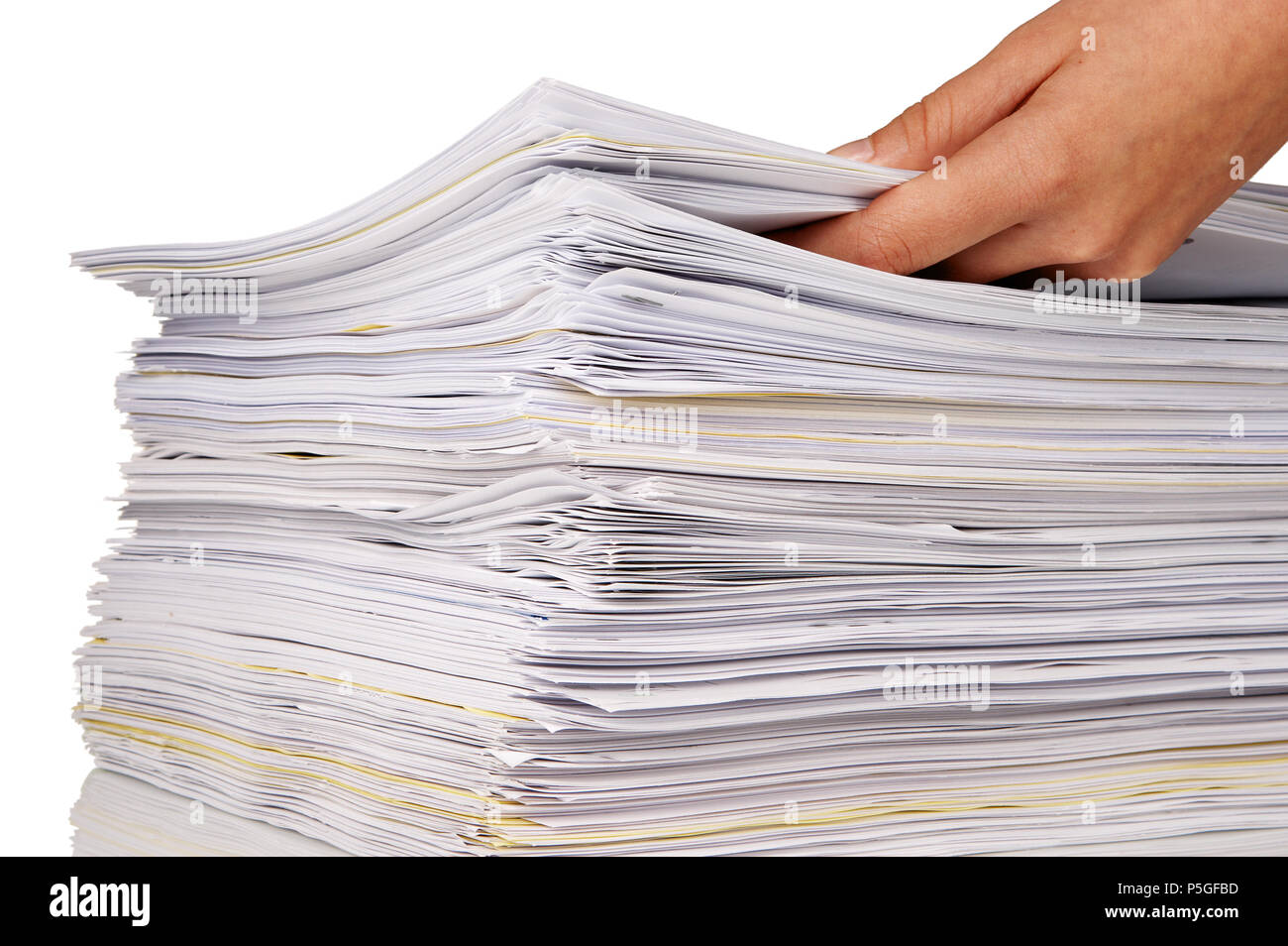 Hand adding more files to a large stack of documents Stock Photo - Alamy