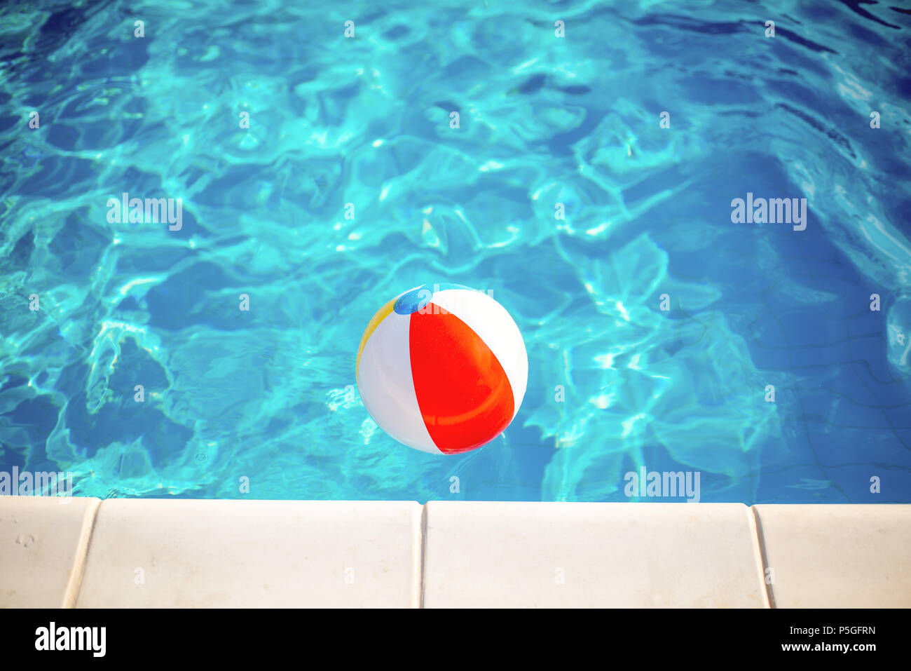 Ball at the swimming pool Stock Photo - Alamy