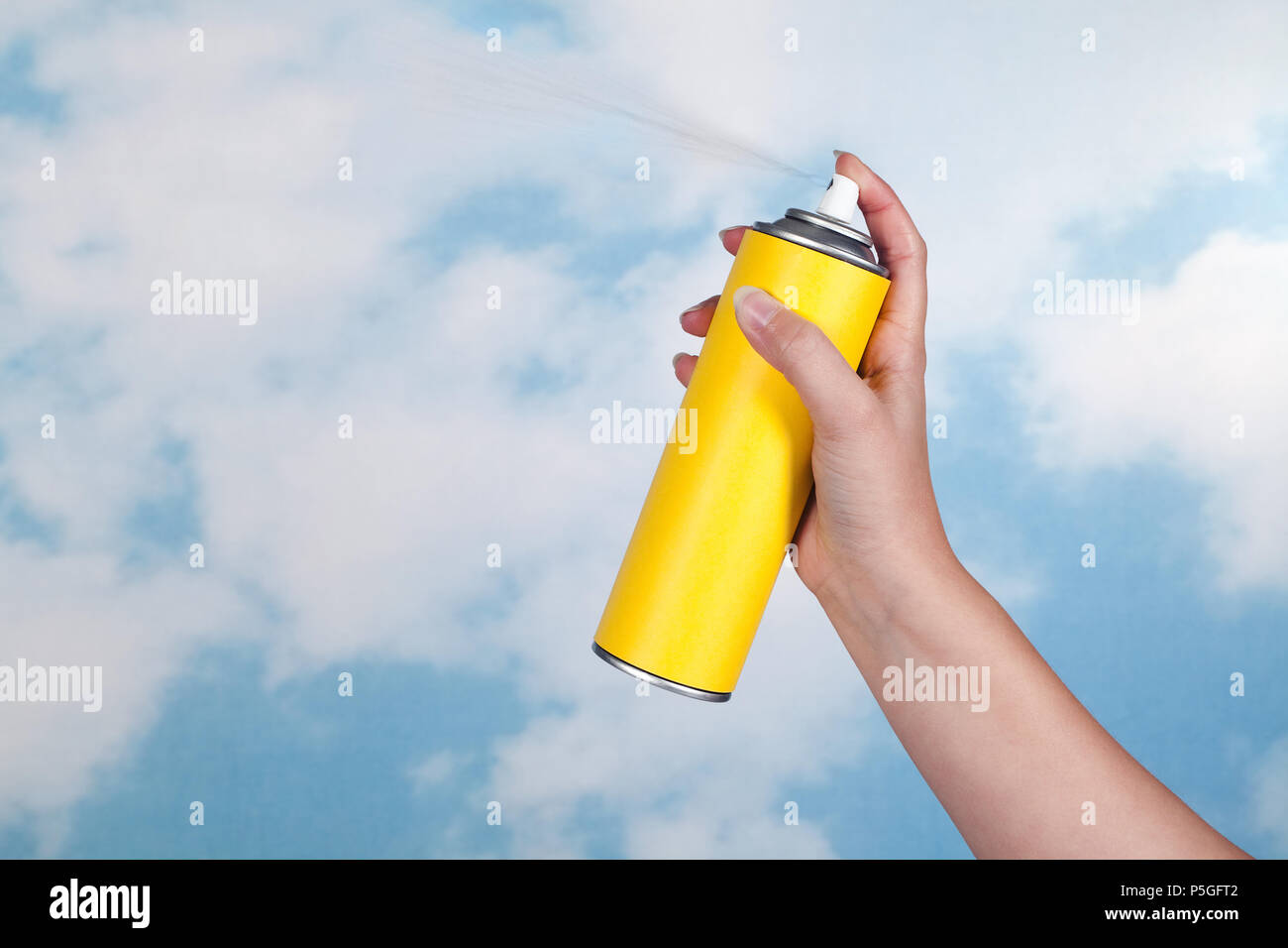 Hand spraying a substance like insecticide into open air Stock Photo ...