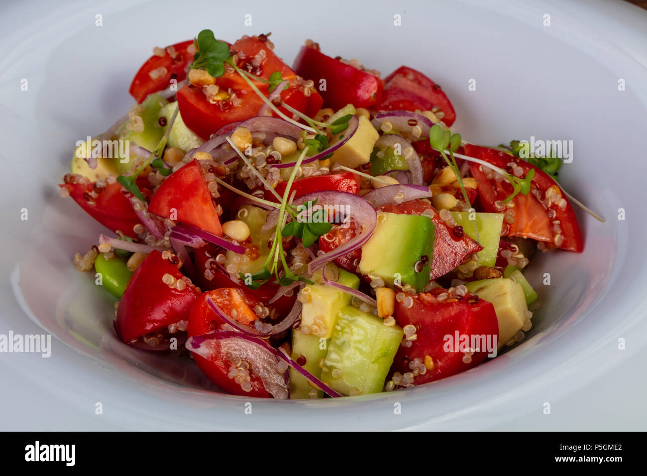 Salad with Kinoa, avocado and vegetables Stock Photo - Alamy