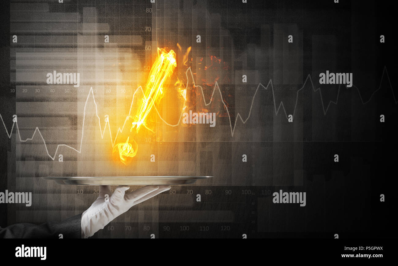 Waitress's hand keeping flaming exclamation mark Stock Photo - Alamy