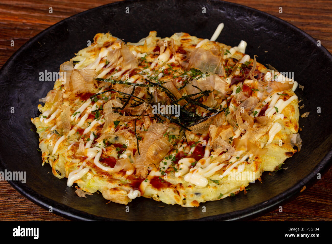 Japanese pizza with seafood and fish Stock Photo - Alamy