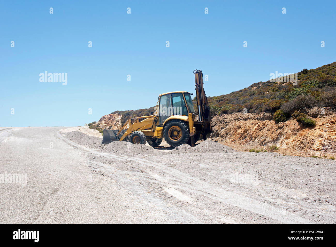 A bulldozer in the making of a road in a construction site Stock Photo ...