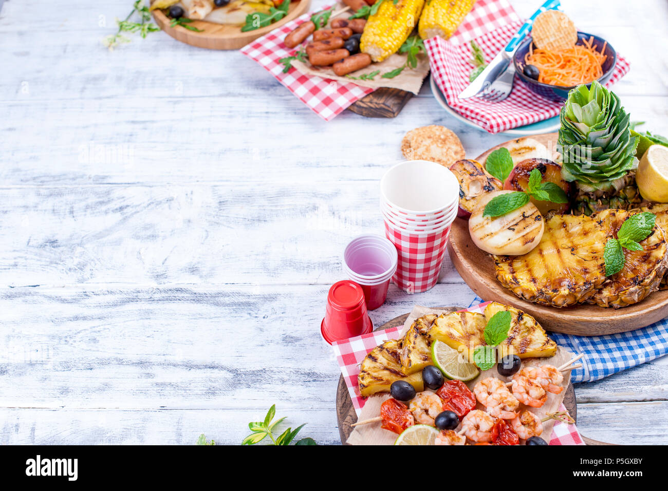 Vegetables, fruits and shrimp on the grill, for a summer lunch. Healthy ...