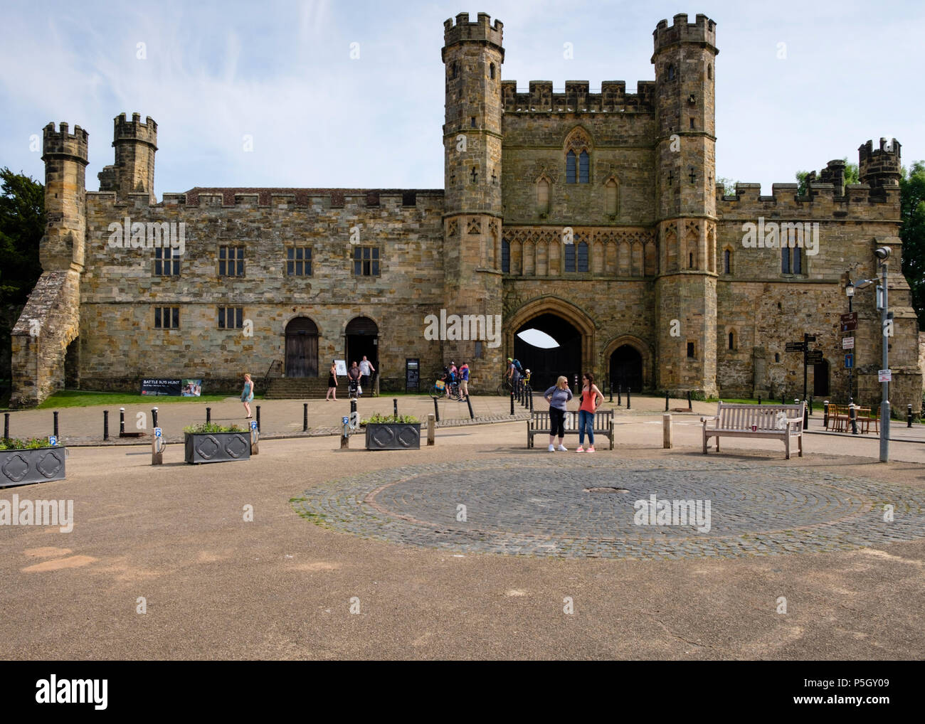 The gatehouse and keep leading to the ruins of Battle Abbey and modern ...