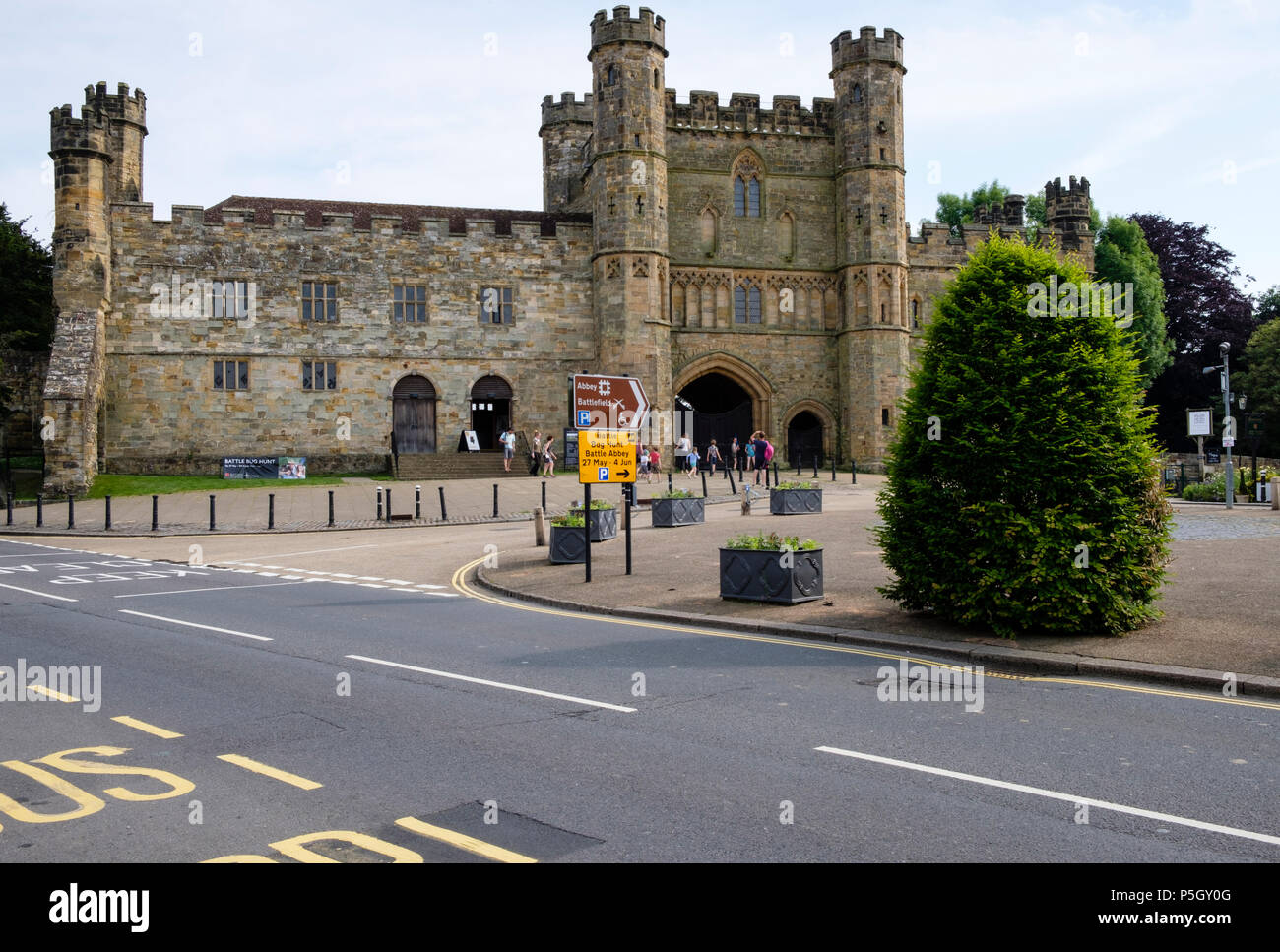 The gatehouse and keep leading to the ruins of Battle Abbey and modern ...