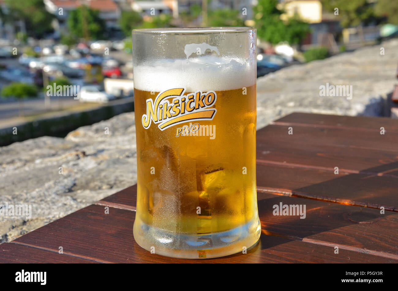 A pint glass of Nikšićko lager beer, Old Town, Kotor, Bay of Kotor ...