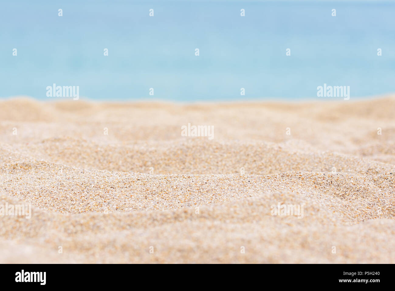 Sea sand and blue sea background. Sandy tropical beach with a blurred ...
