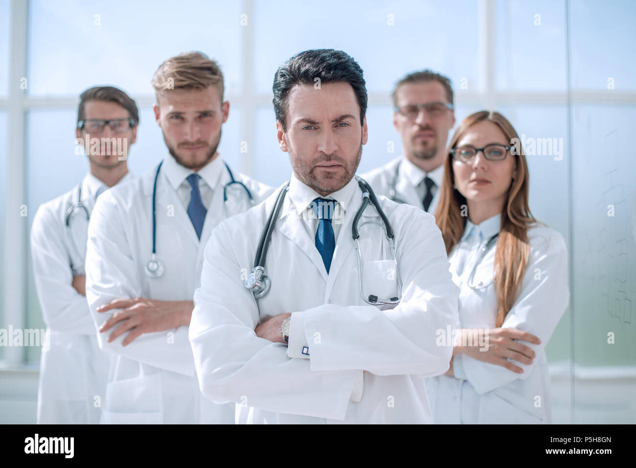 portrait of doctor and medical staff standing in the office Stock Photo ...