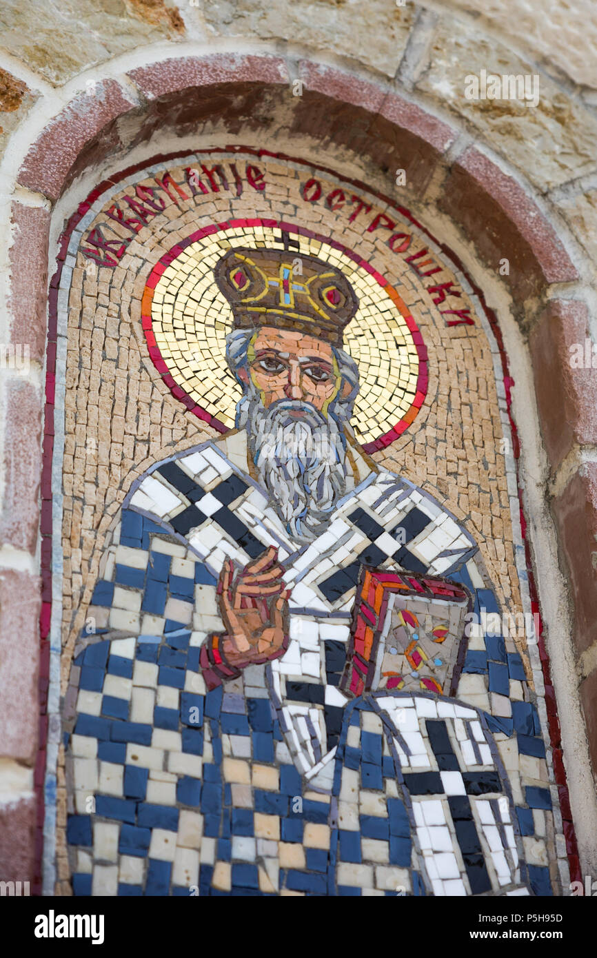 Mosaic artwork of Saint Basil of Ostrog religious figure on gate post ...