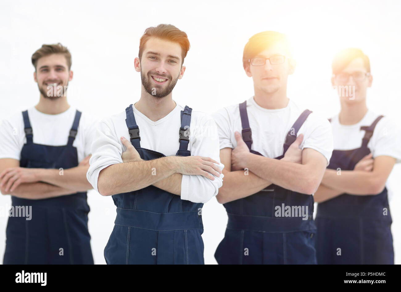 Happy team of responsible movers and their smiling leader Stock Photo ...
