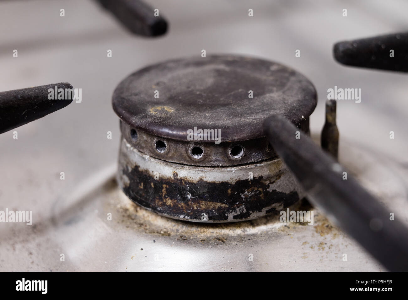 An old dirty gas kitchen. Device for preparing dishes in the kitchen ...