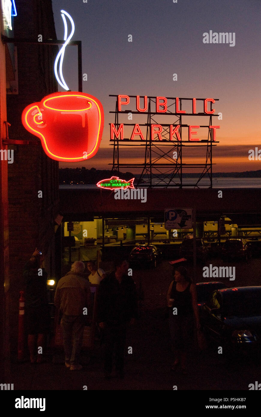 A neon coffee cup sign, neon Public Market and City Fish Market signs ...