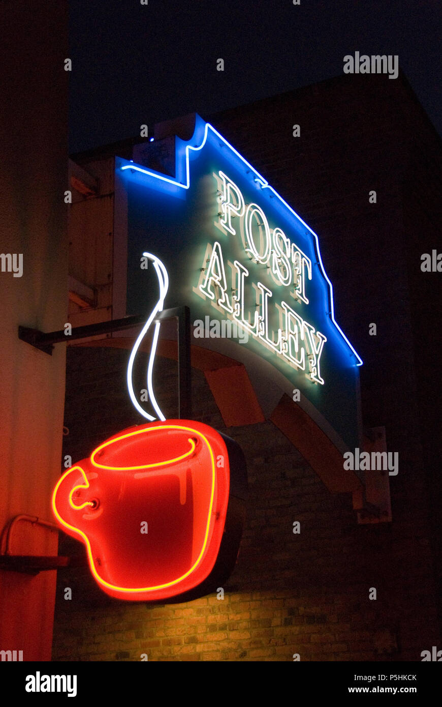 A neon coffee cup sign at Post Alley, a lane of restaurants in downtown ...