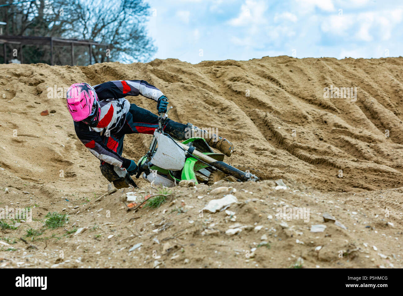 Close-up of accident in mountain bikes race in dirt track during an ...