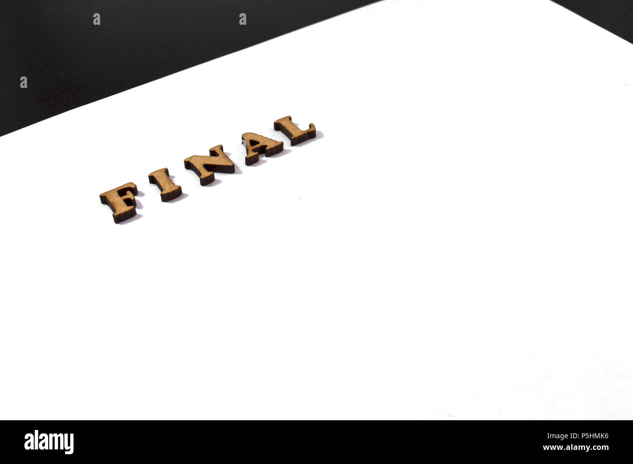Word 'Final' written with wood letters isolated on white background ...