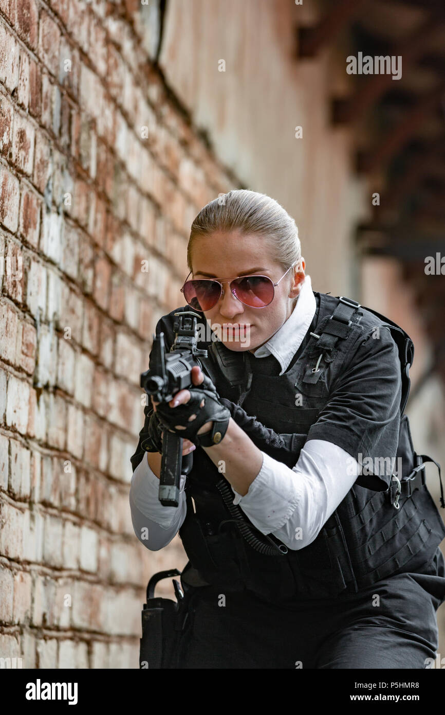 Powerful Woman Holding Gun. War Action Movie Style Stock Photo - Alamy