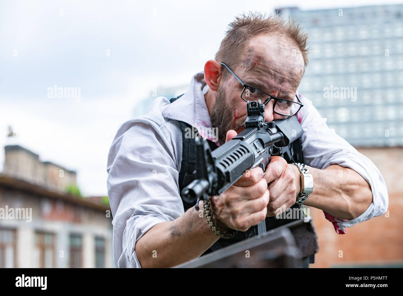 Powerful man Holding Gun. War Action Movie Style Stock Photo - Alamy