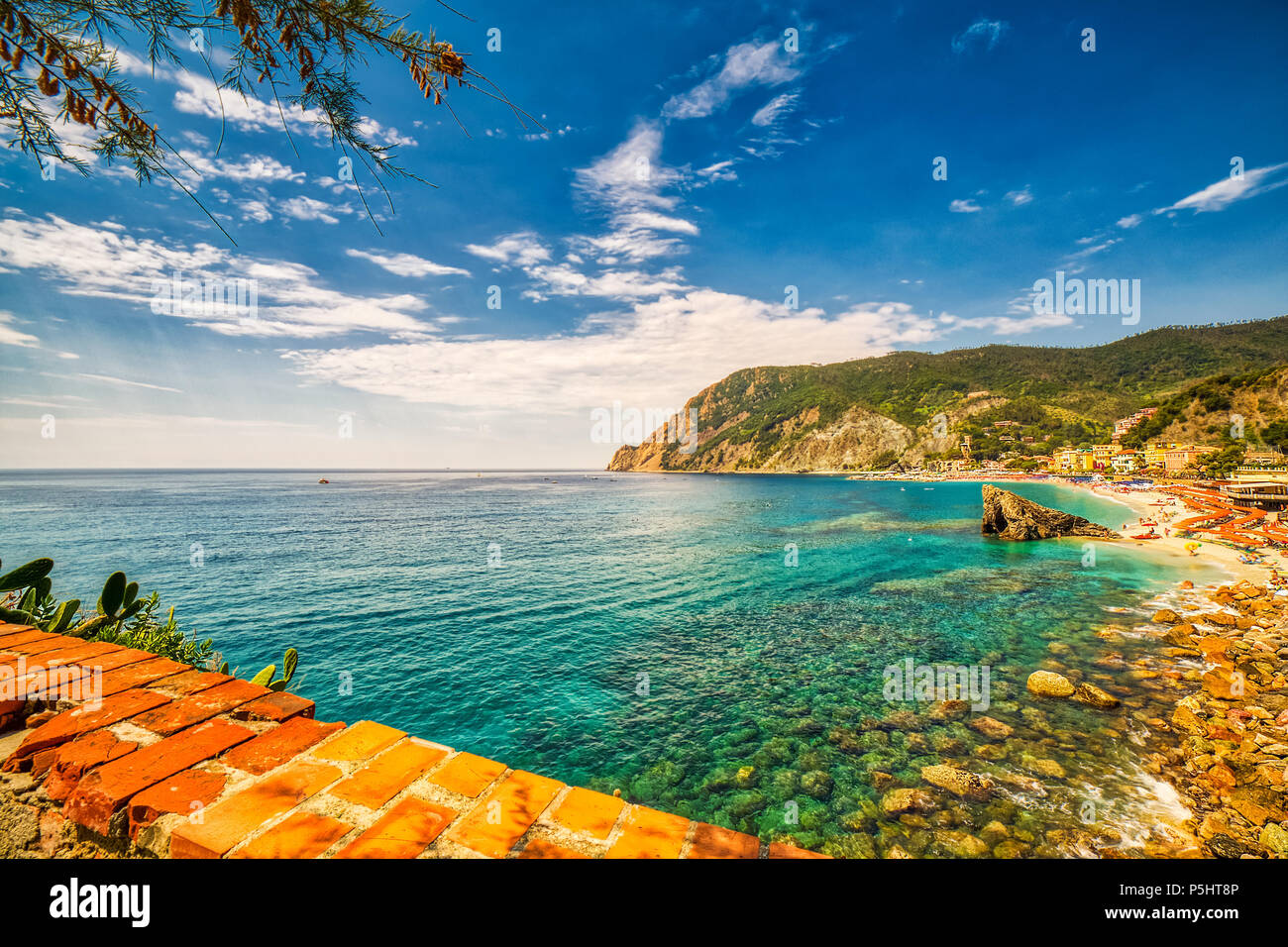 view of rocks and sandy beach in Italy Stock Photo - Alamy