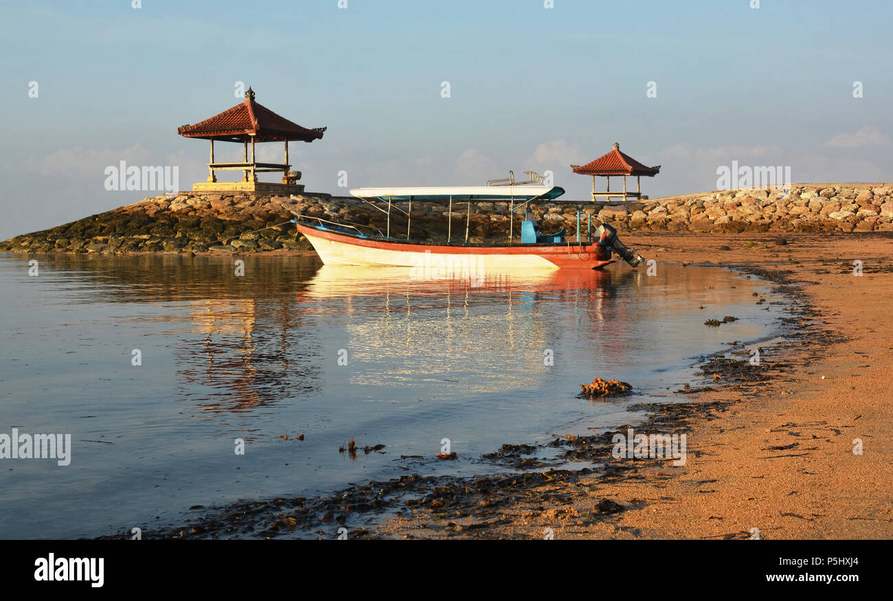 Glass Bottom Tourist Reef Viewing Boat and reflections at dawn on Sanur ...