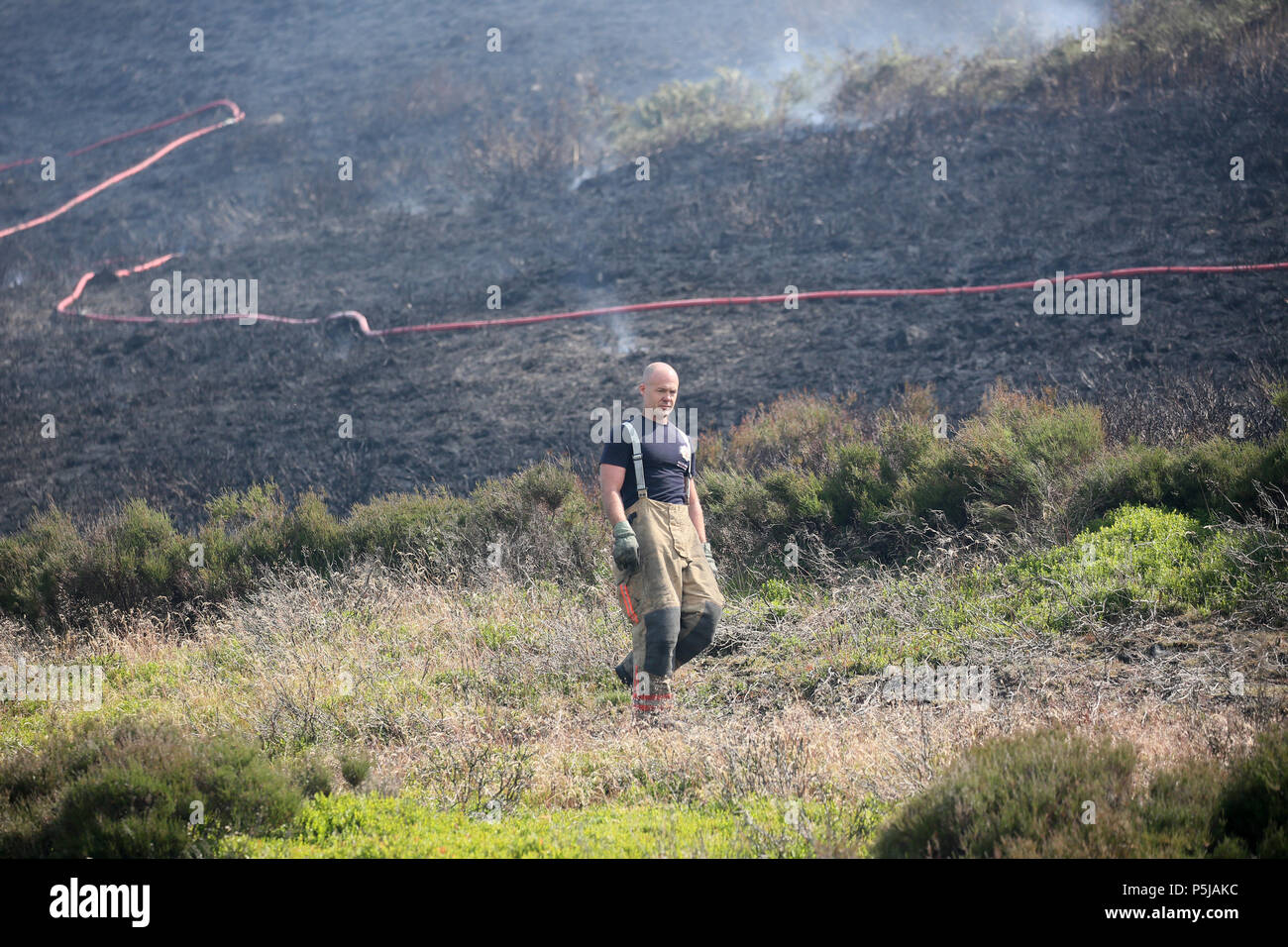 Saddleworth, UK. 27th Jun, 2018. Fire fighters continue to tackle ...