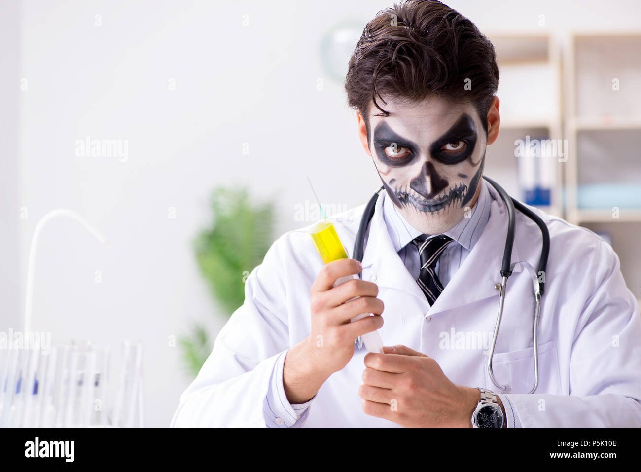 Scary monster doctor working in lab Stock Photo - Alamy